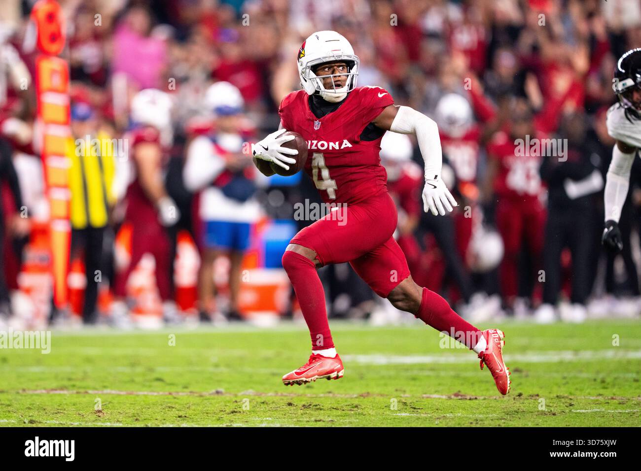 Arizona Cardinals wide receiver Greg Dortch (4) runs with the ball for ...