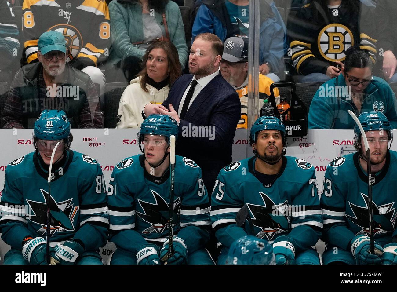 San Jose Sharks head coach Ryan Warsofsky, standing, reacts behind players on the bench during ...