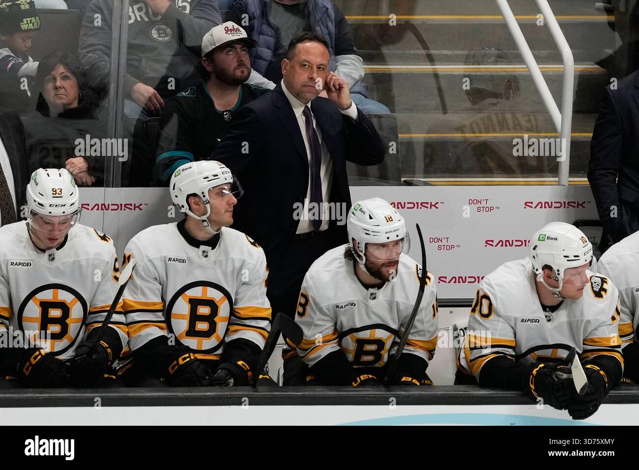 Boston Bruins head coach Marco Sturm, standing, reacts behind players on the bench during the ...