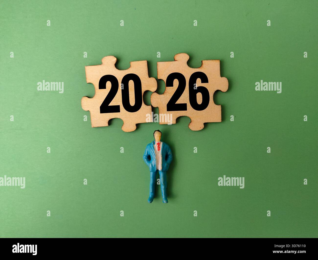 The image depicts two jigsaw puzzle pieces forming the number 2026 ...