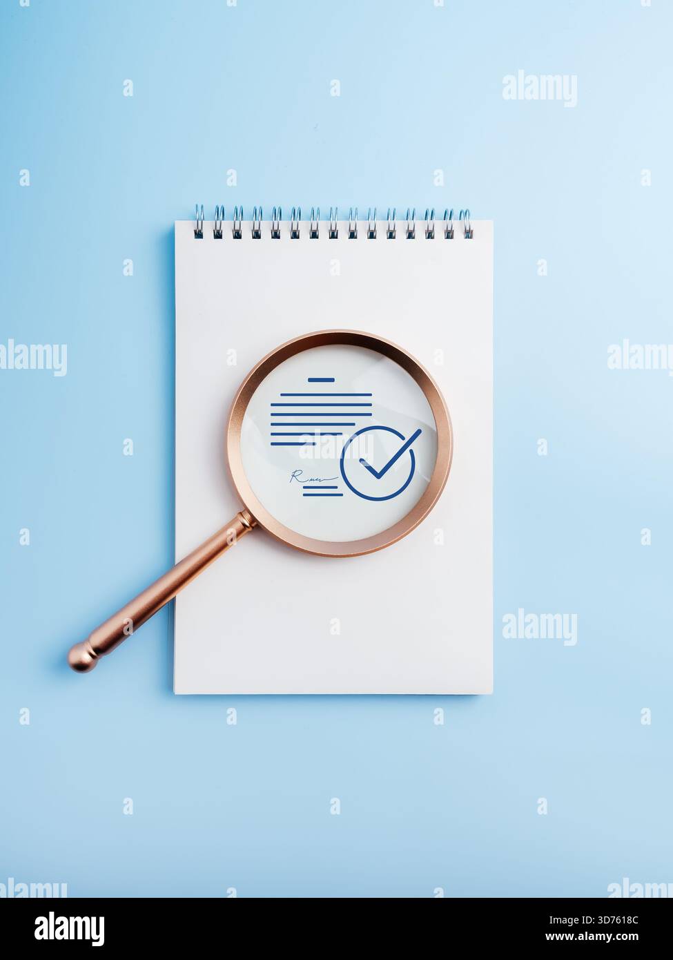 Document verification concept with magnifying glass focusing on ...