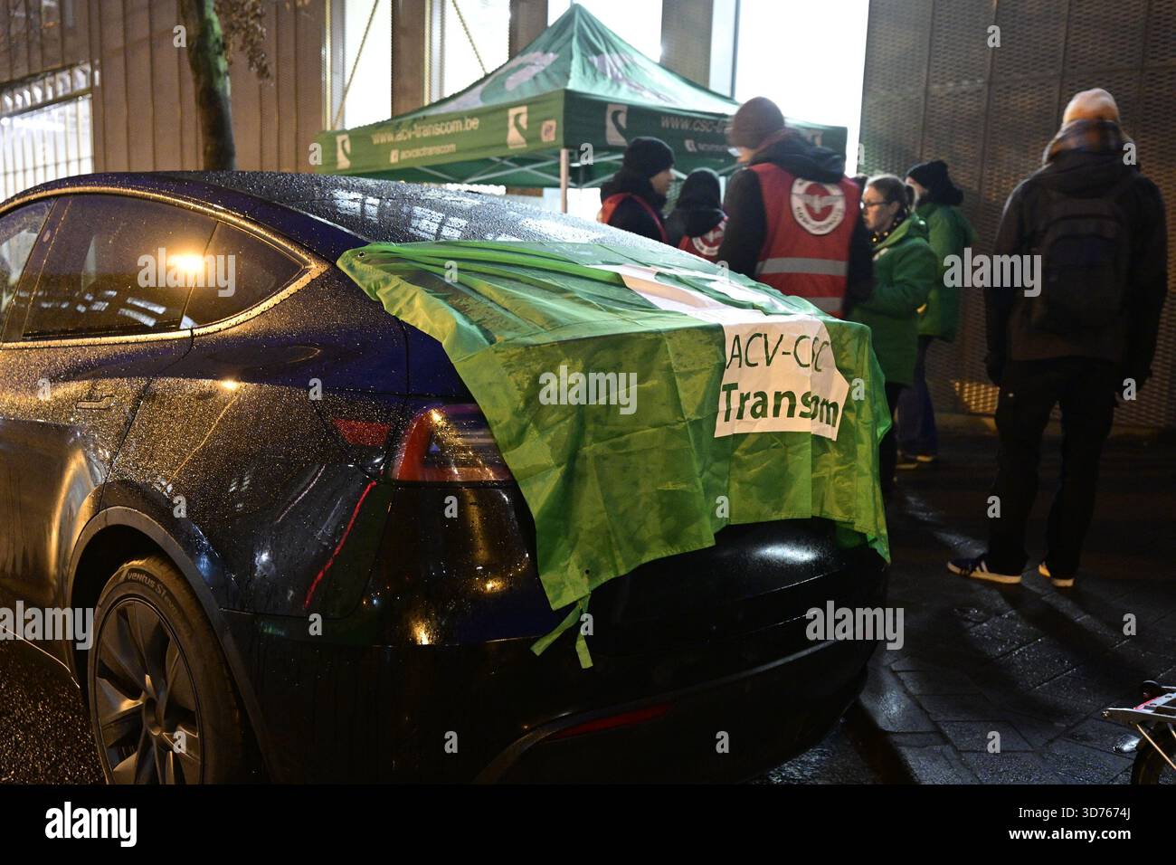A flag of ACV - CSC union transcom and workers on strike pictured ahead ...
