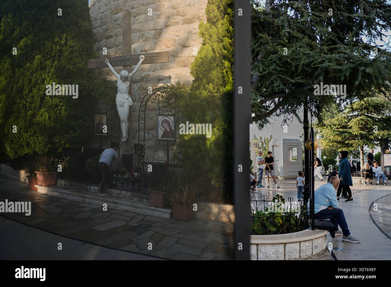 Pilgrims visit and pray around the grounds of the Our Lady of Lebanon ...