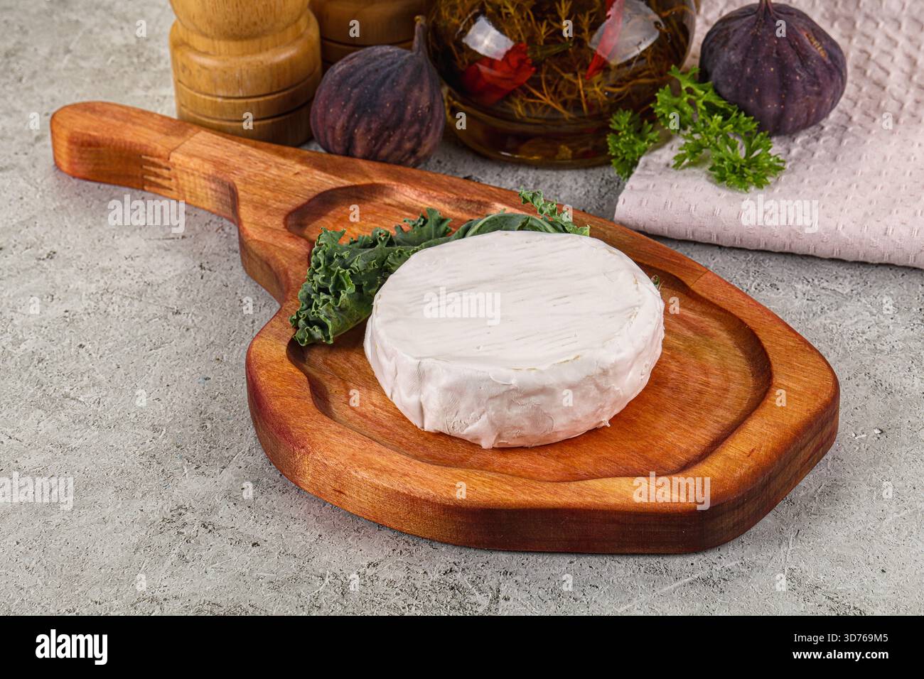 Gourmet round creamy Camembert cheese served fig Stock Photo - Alamy