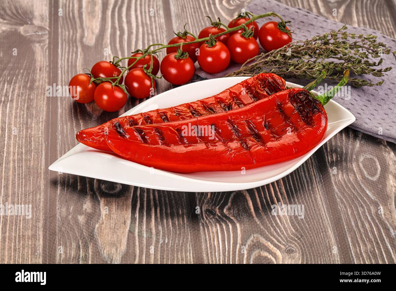 Grilled whole red paprika ramiro pepper Stock Photo - Alamy