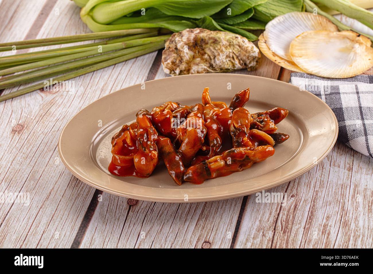 Razor shell mollusk with spicy sauce Stock Photo - Alamy