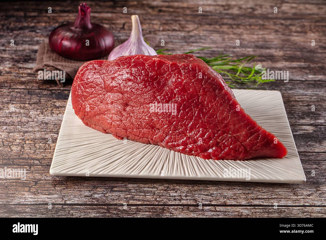 Raw red beef meat fillet piece Stock Photo - Alamy
