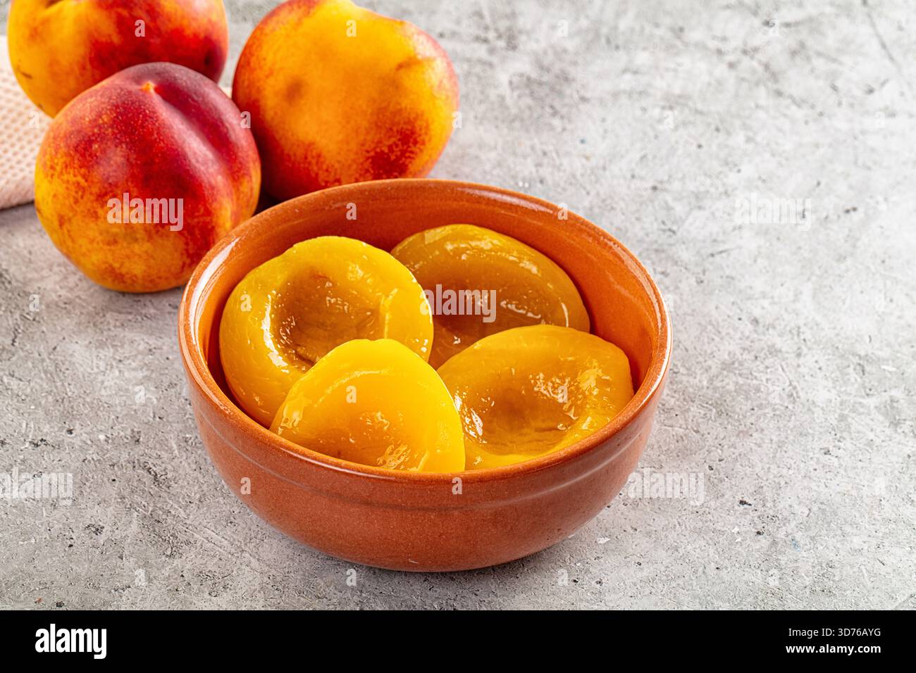 Sweet juicy canned peaches dessert snack Stock Photo - Alamy