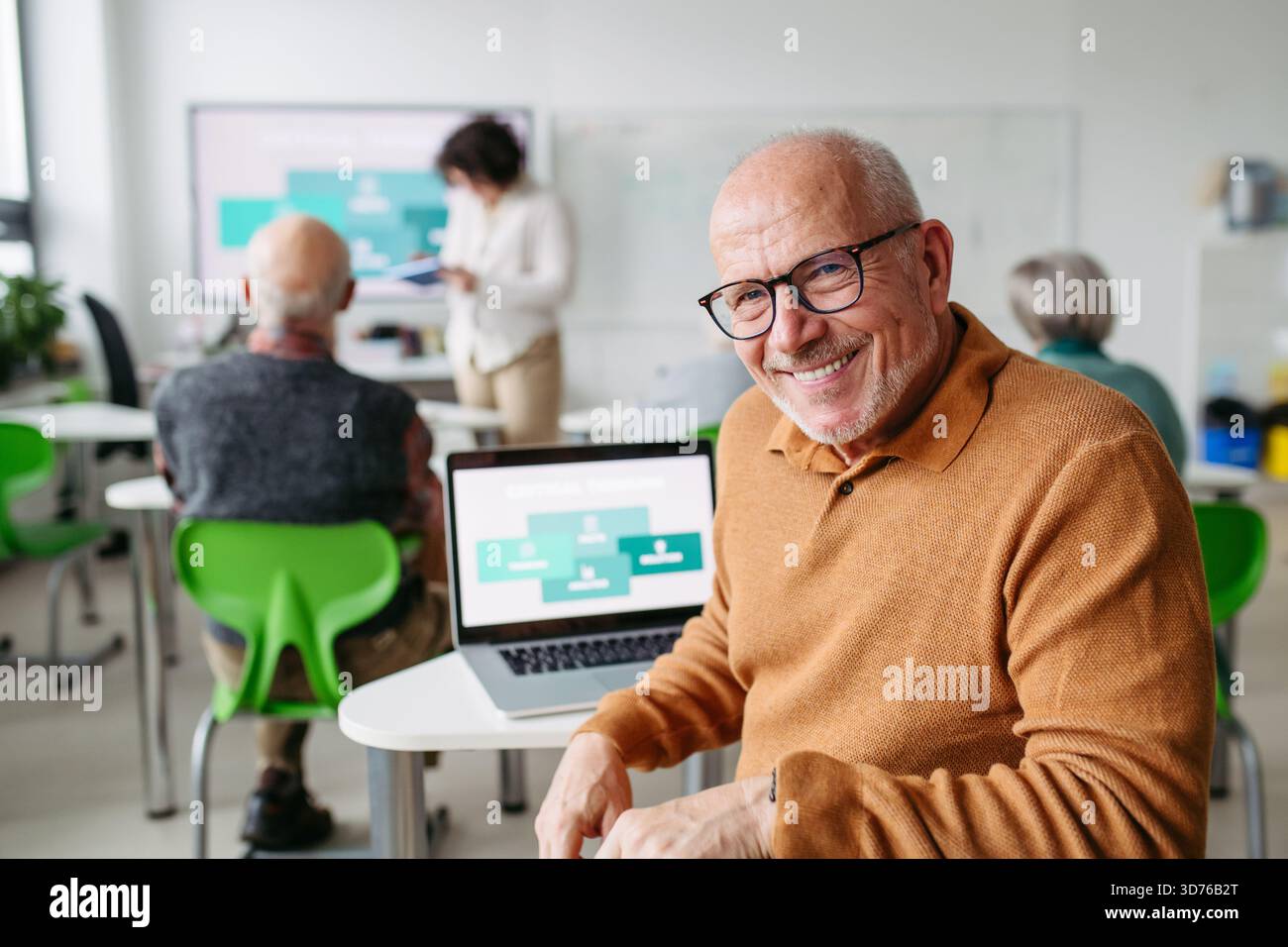 Senior man learning digital skills in community center Stock Photo - Alamy