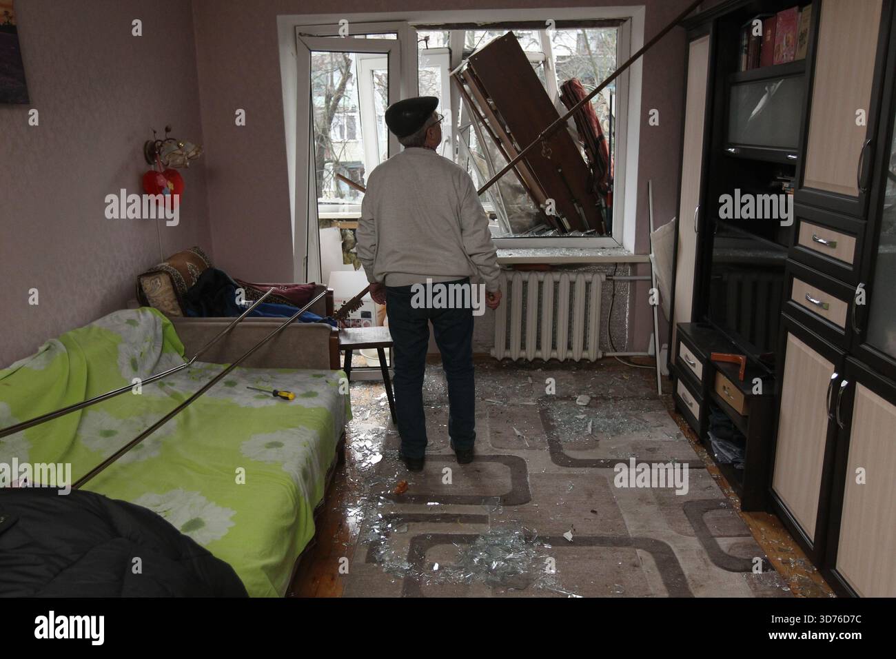 Resident Viktor Mykhailenko looks at damage done to his apartment by a ...