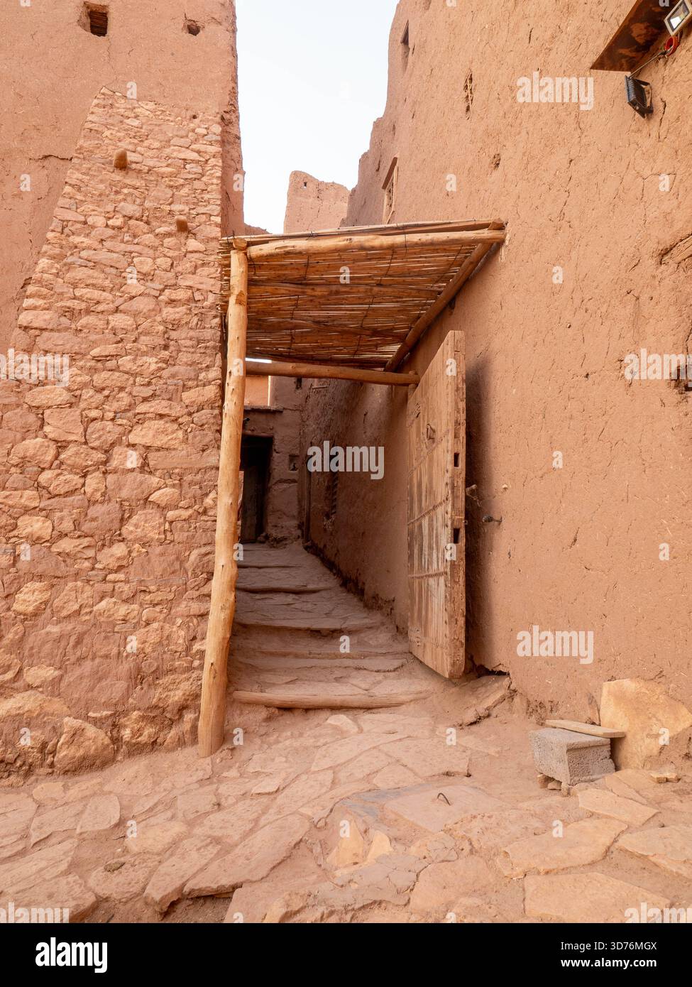 Typical narrow passageway between high earthen walls in a traditional ...
