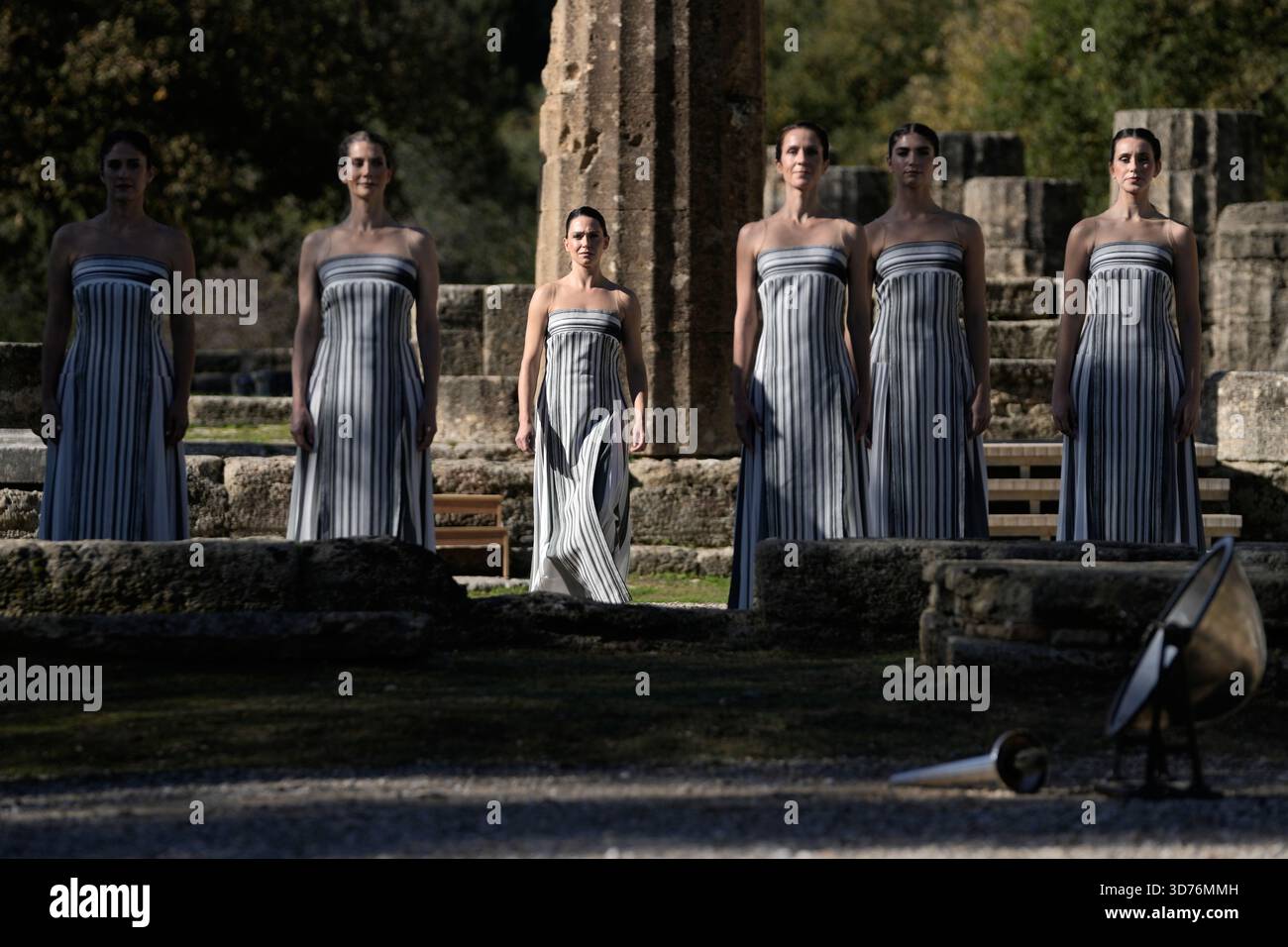 Actor Mary Mina playing the role of high priestess, center, performs ...