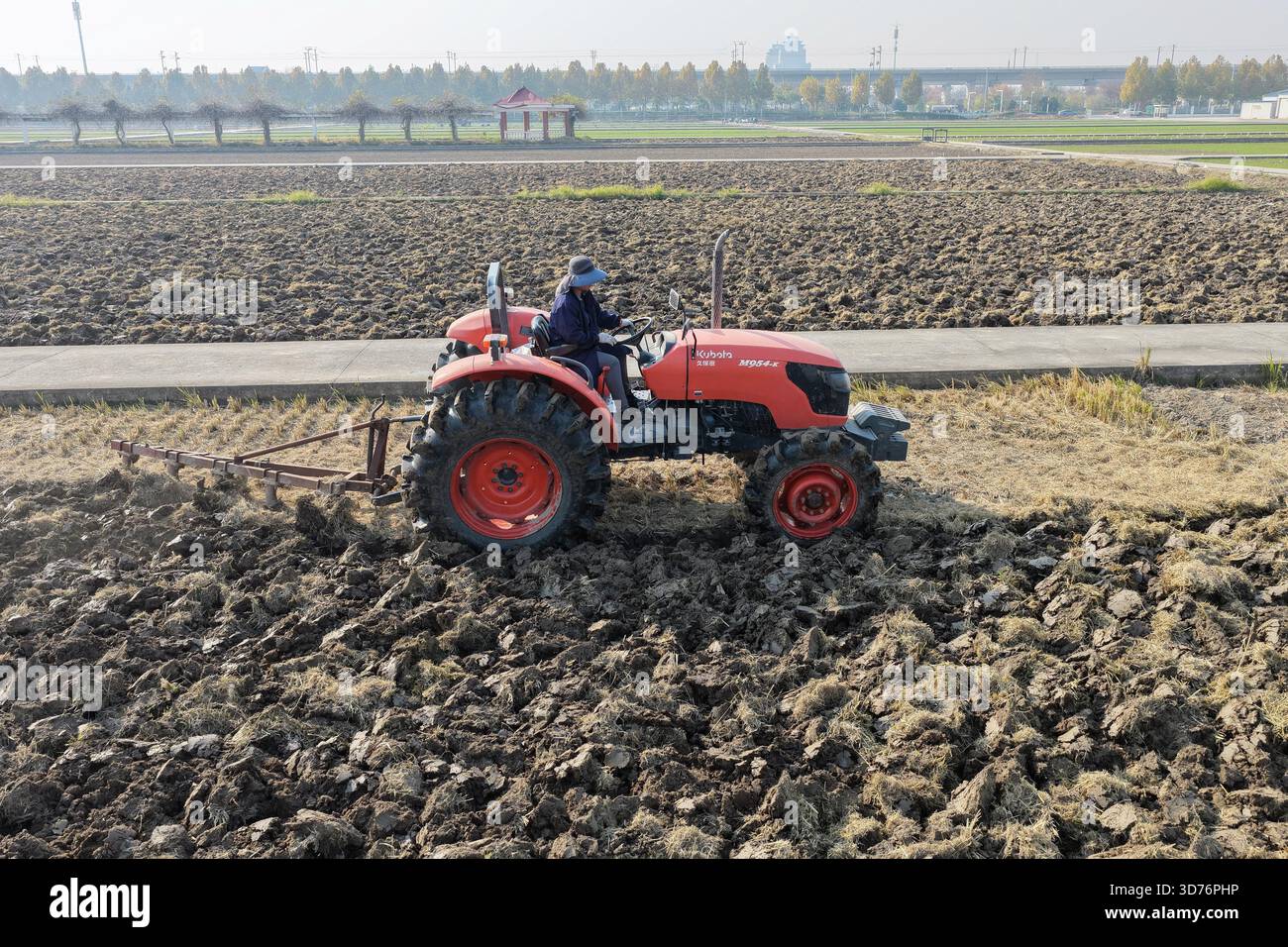 Aerial photo shows farmers working in the field in Yangzhou City, east ...
