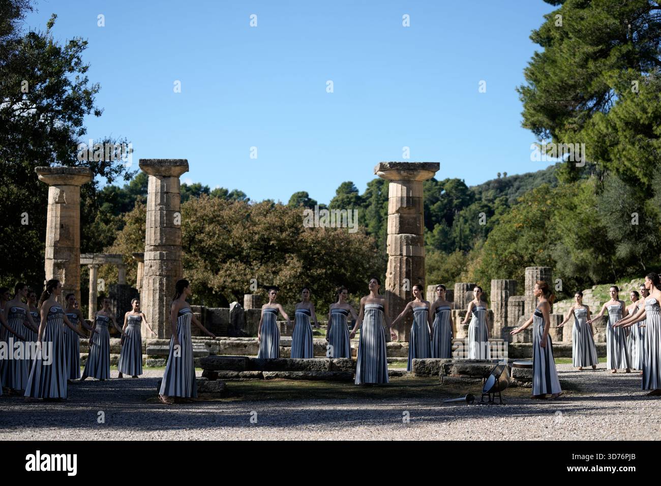 Actor Mary Mina playing the role of high priestess, center, performs ...