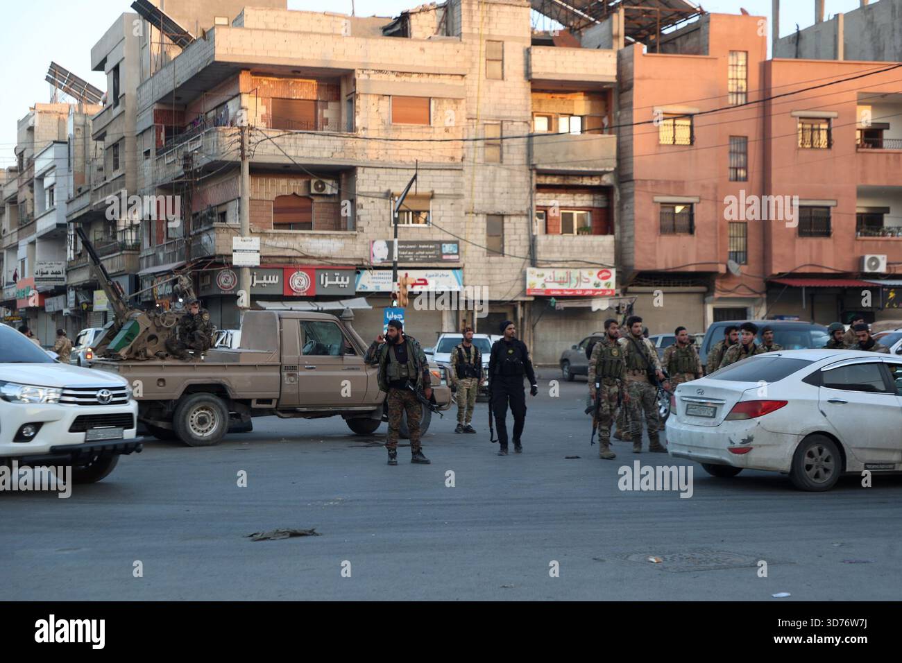 Homs, Syria. 23rd Nov, 2025. Soldiers of Syrian security forces stand ...