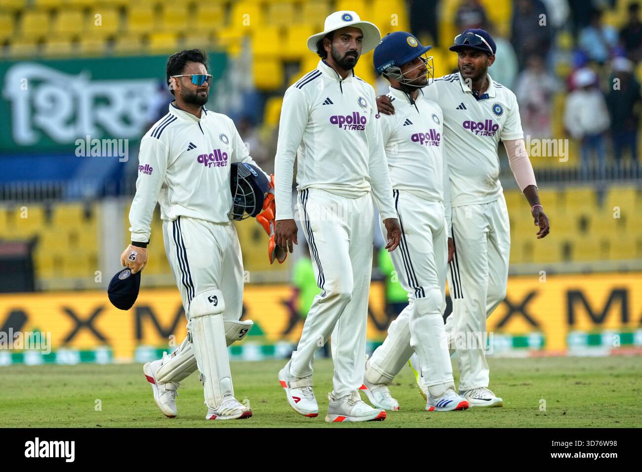 India's players walk off the field at the end of the third day of the ...