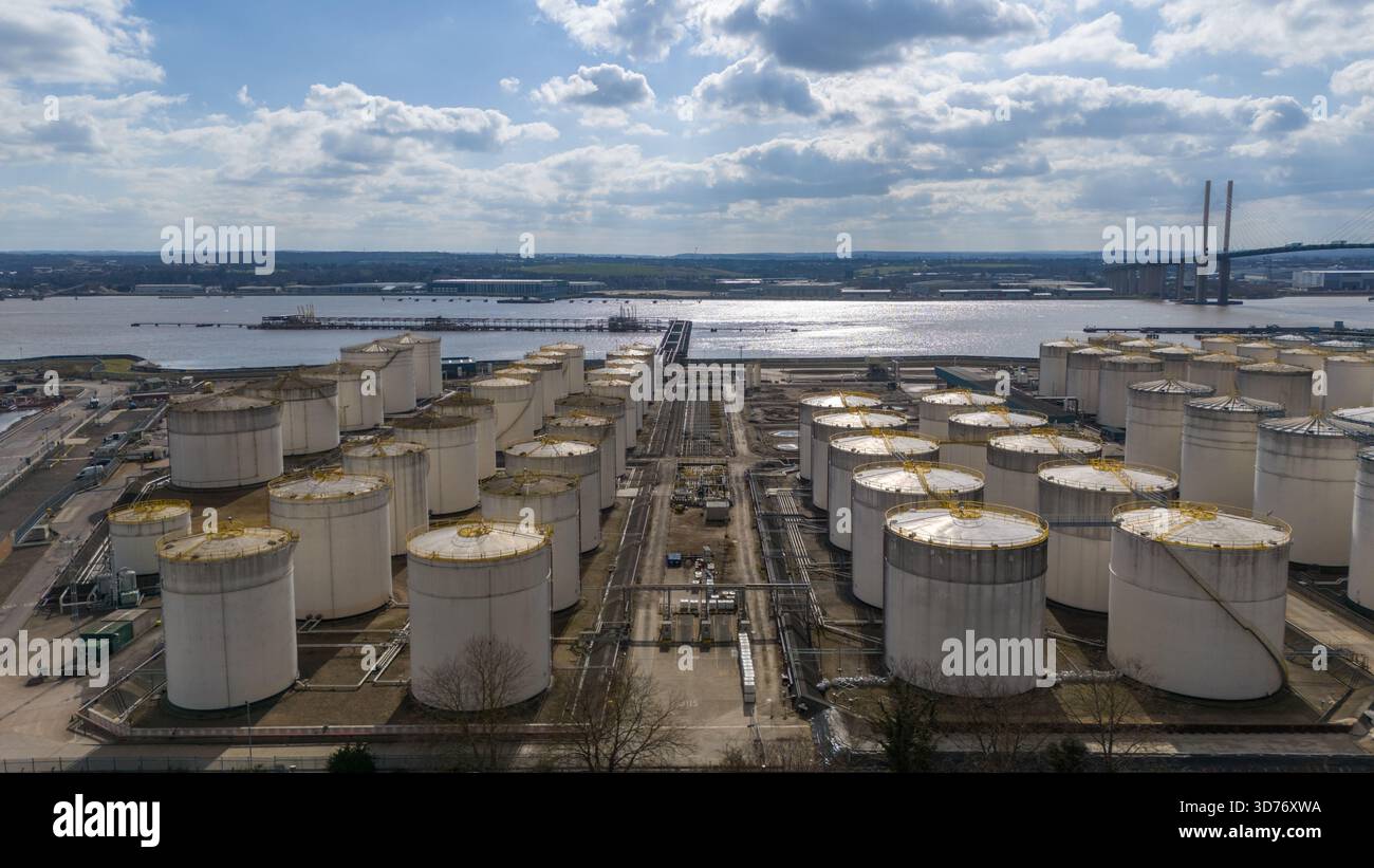 Aerial view of a multitude of white storage tanks gleaming under the ...