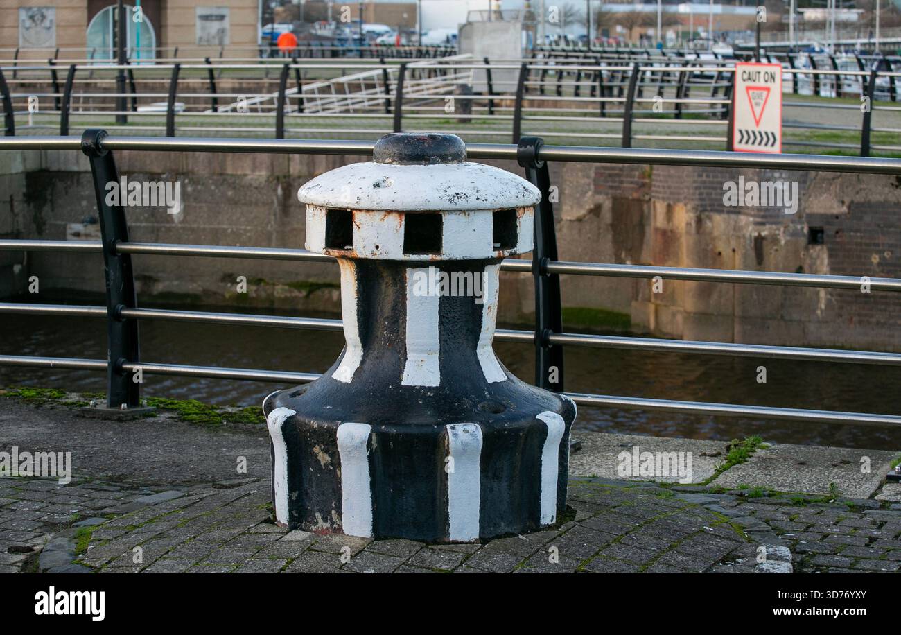 An old disused capstan at the entrance to Swansea Marina in South Wales ...