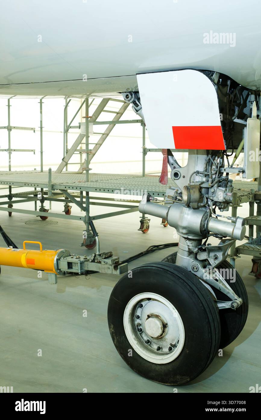Close-up of the landing gear displayed in an aircraft hangar ...