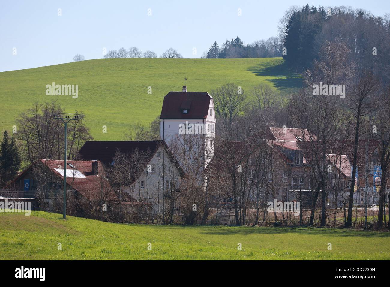 A small town with a few houses and a church Stock Photo - Alamy