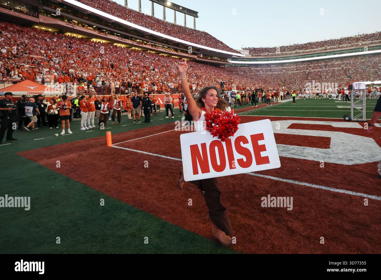 AUSTIN, TX - NOVEMBER 22: A Texas Longhorns pom team member runs with ...