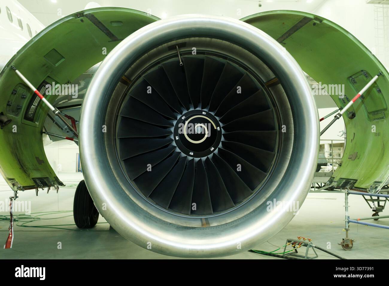 A close-up view reveals the interior of a large aircraft engine ...