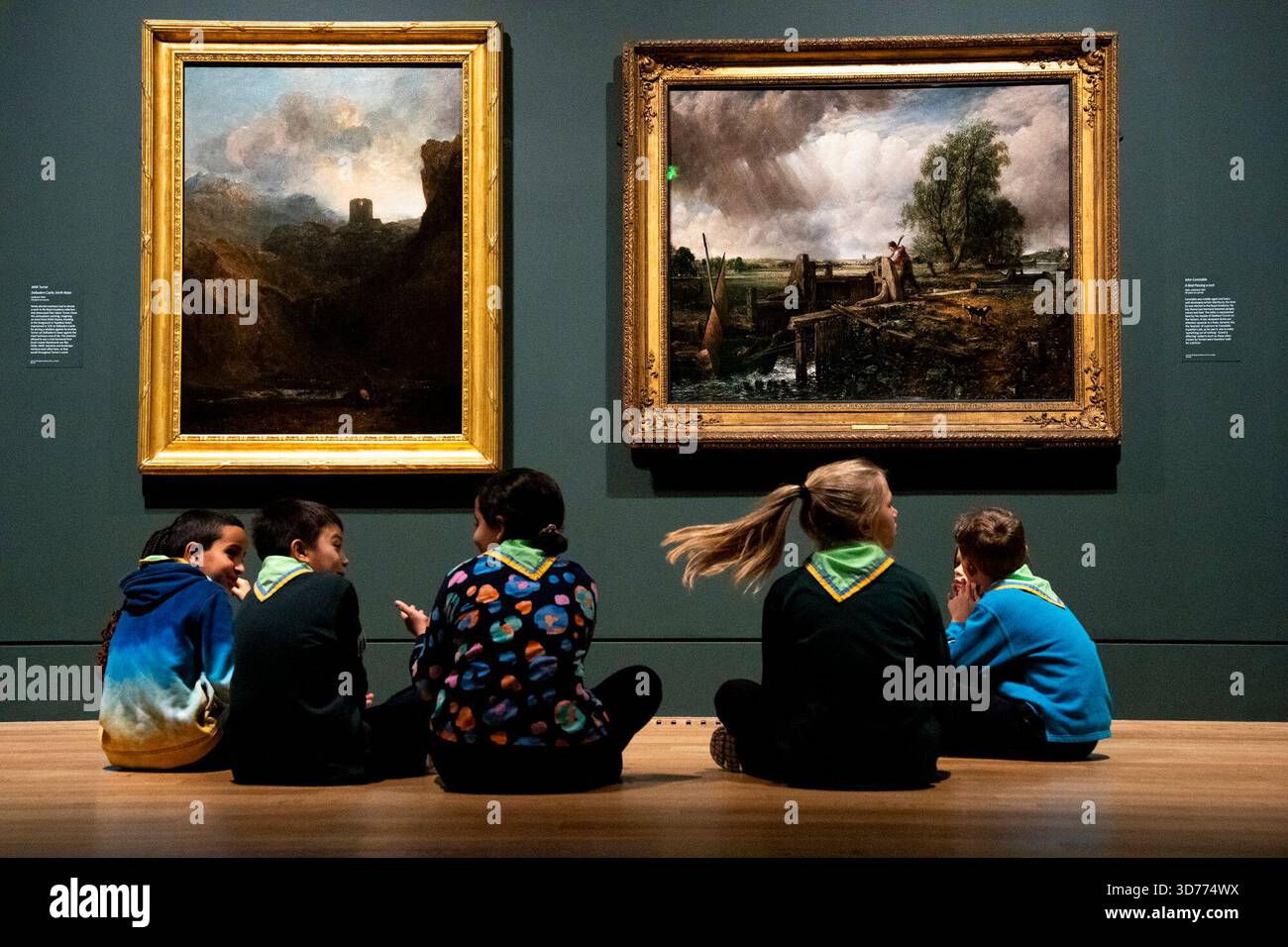A troop of scouts look at 'Dolbadern Castle, North Wales' by Joseph ...