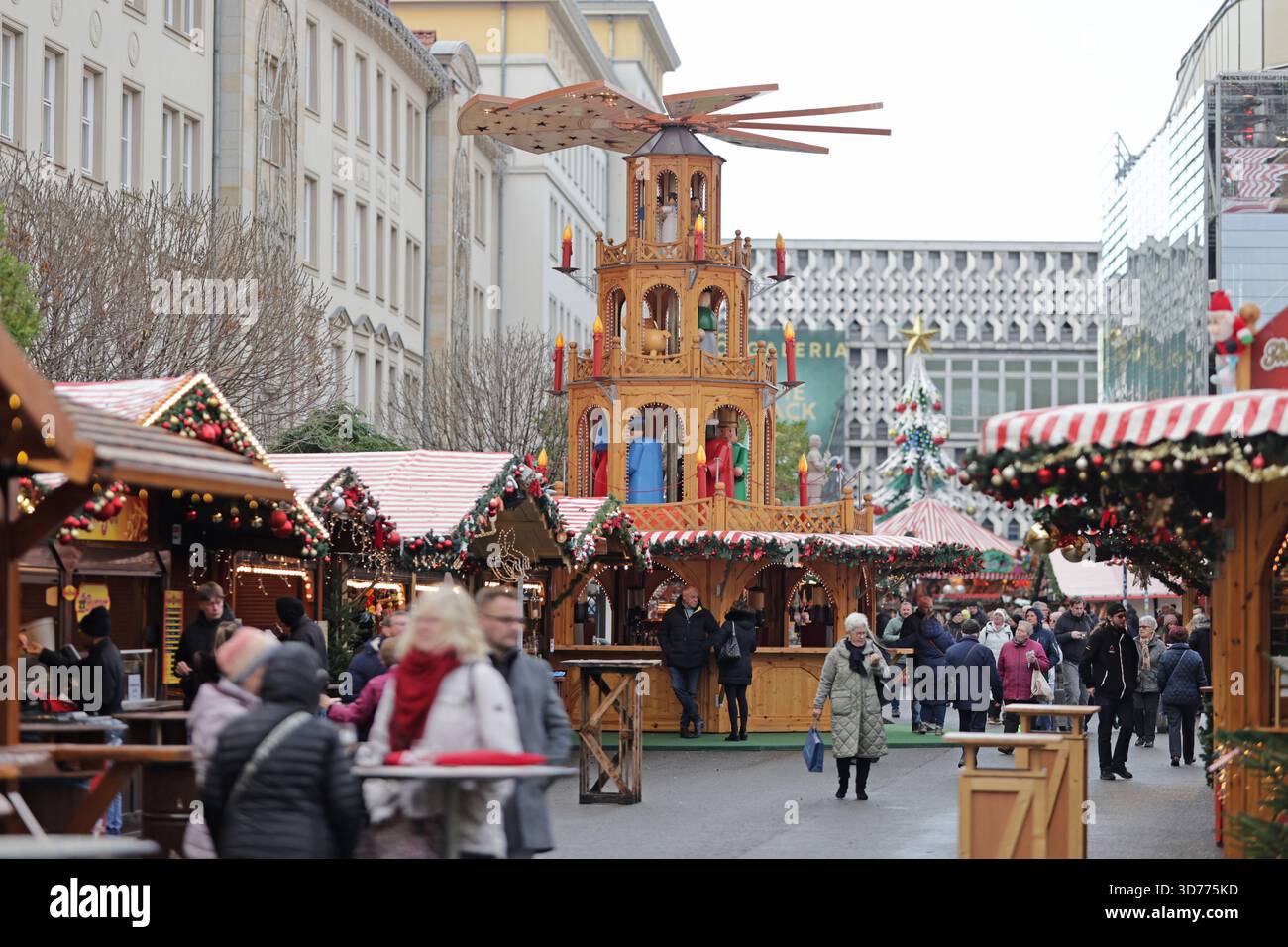 Visitors walk through the Magdeburg Christmas market, in Magdeburg ...