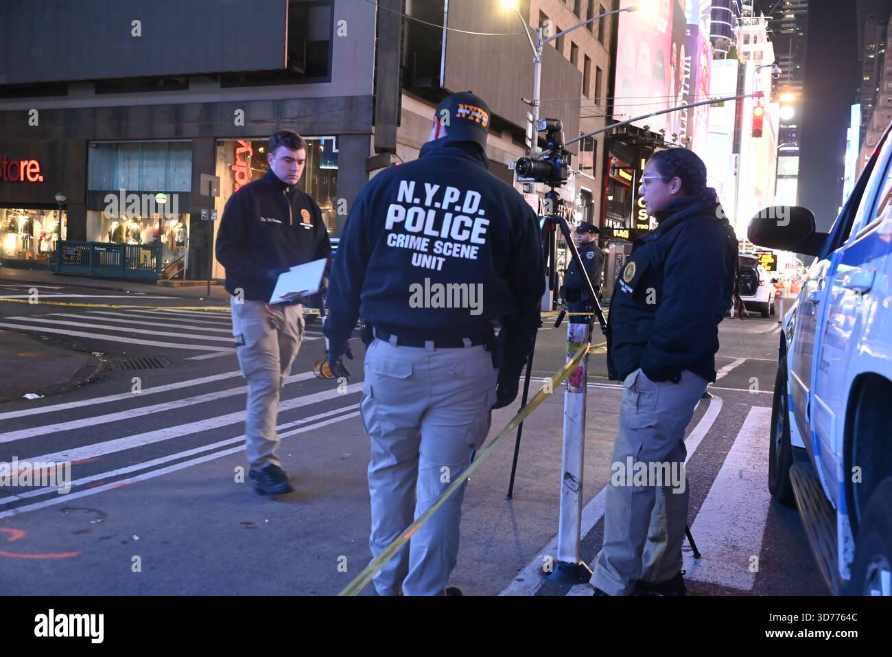 NYPD evidence technicians work the scene and collect evidence including ...