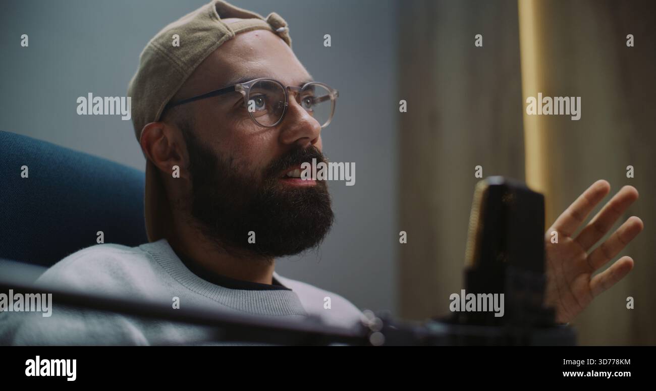 Confident bearded presenter wearing cap hi-res stock photography and ...