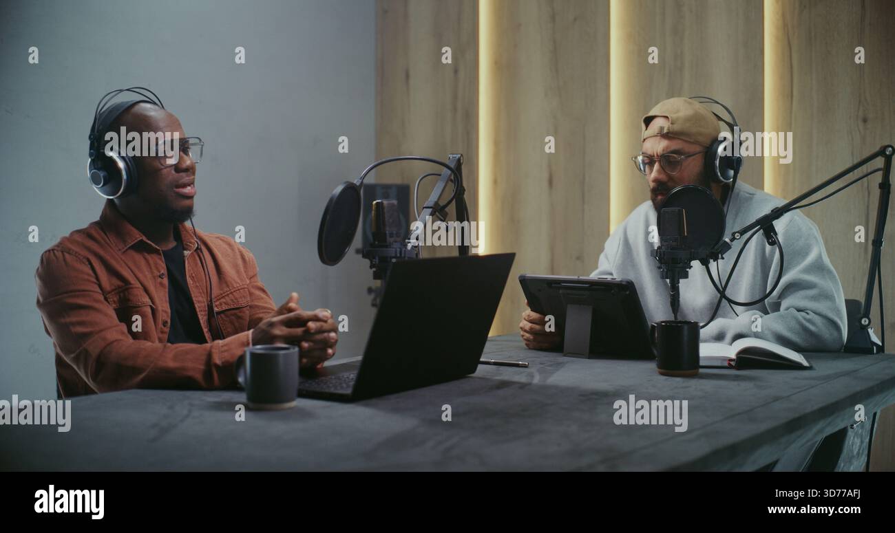 Content creators recording podcast interview hi-res stock photography ...