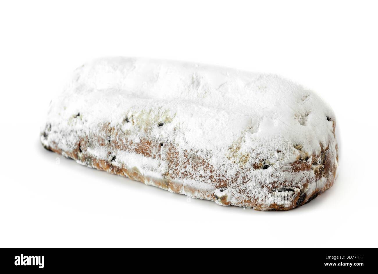 Whole traditional Stollen loaf covered in powdered sugar on white ...