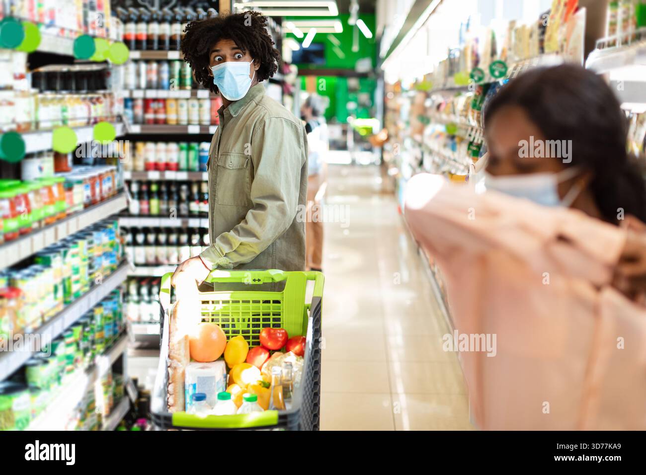 Person Shopping in a Grocery Store With a Cart Full of Fresh Produce ...