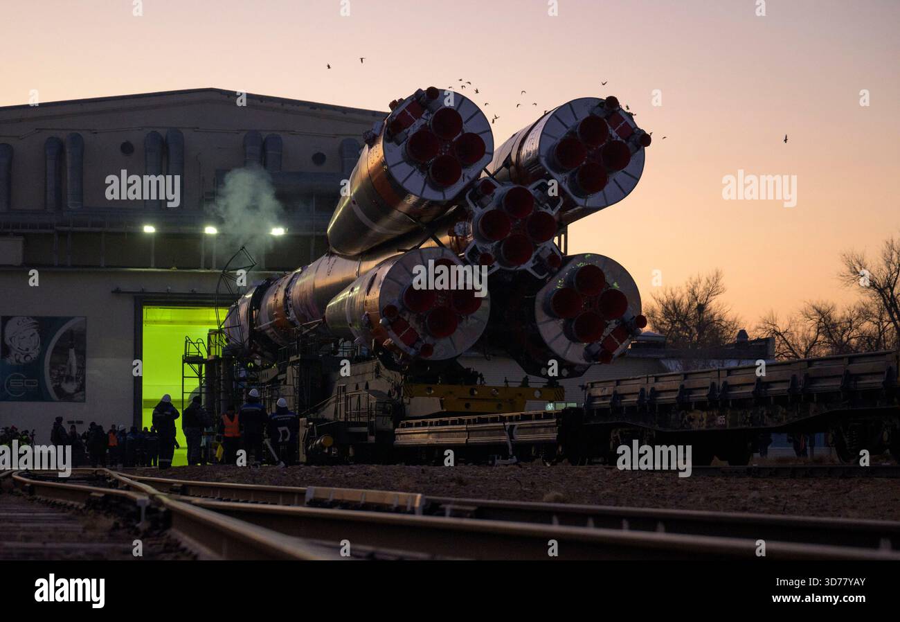 In this photo provided by NASA, the Soyuz rocket is rolled out by train ...