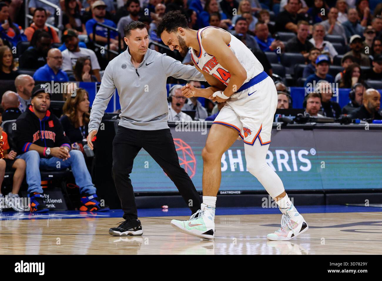 New York Knicks guard Landry Shamet, right, is helped off the court by ...