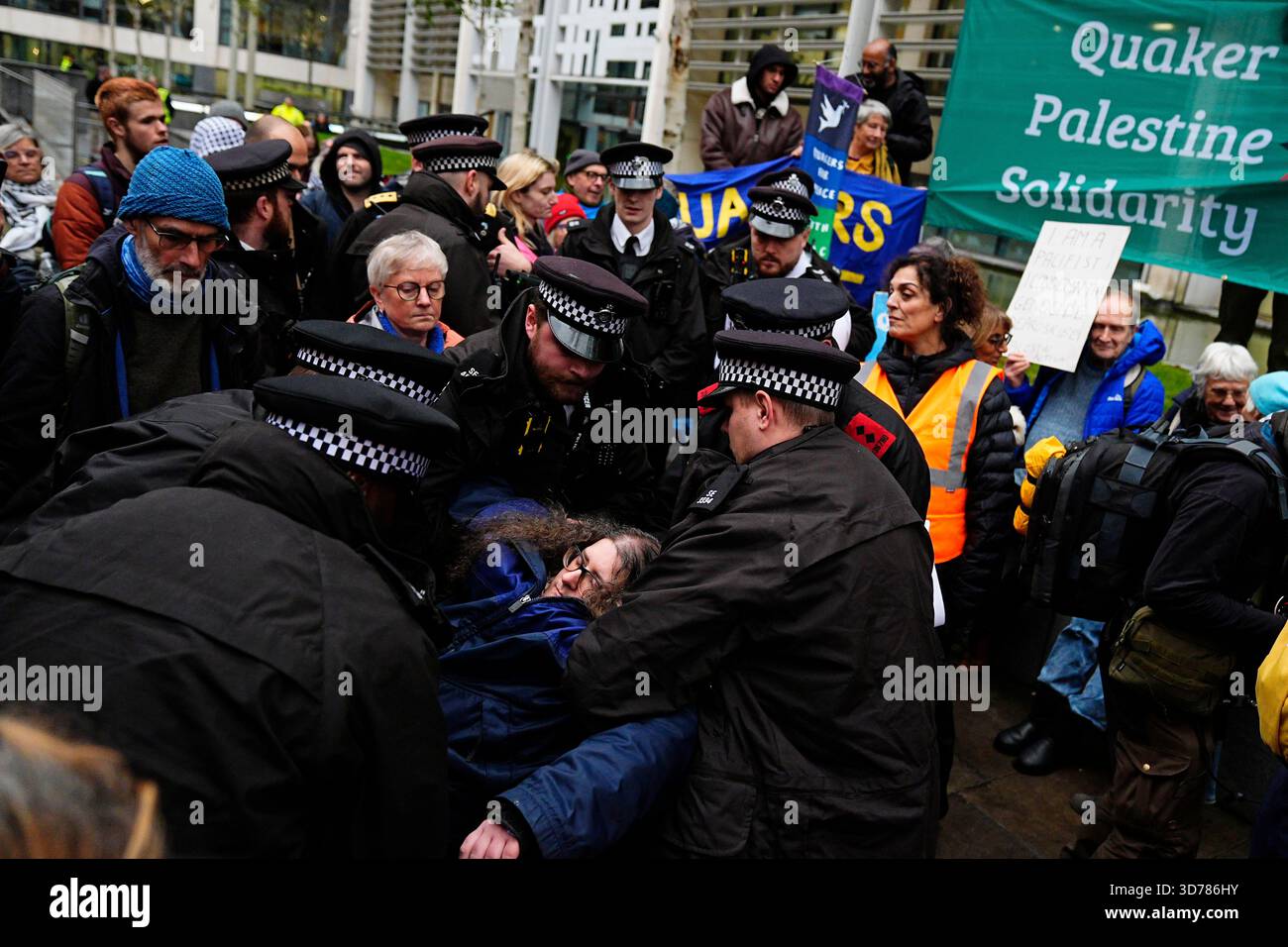 Police remove a campaigner taking part in a Defend Our Juries protest ...