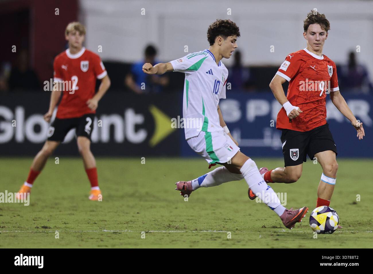 Italy's Samuele Inacio, center, duels for the ball with Austria's Hasan ...