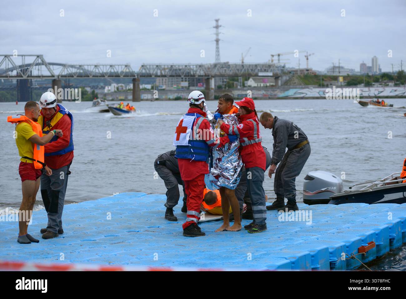Rescuers team carrying sufferer on a stretcher helping him to get to ...