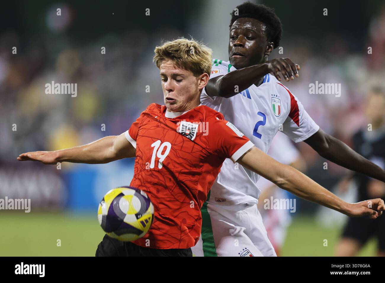 Austria's Johannes Moser, foreground, duels fro the ball with Italy's ...