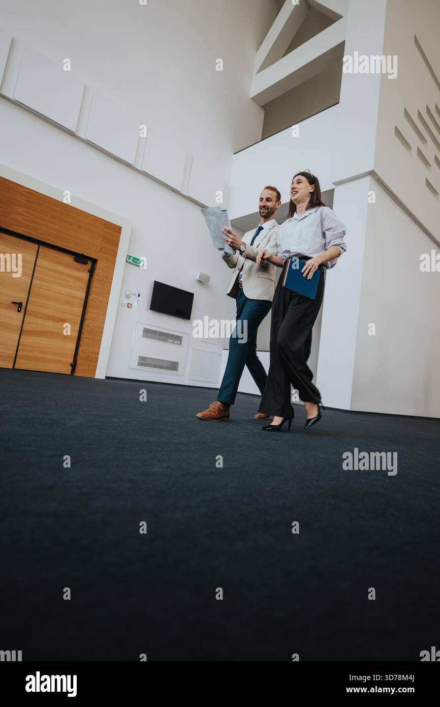 Business partners walk through hi-res stock photography and images - Alamy