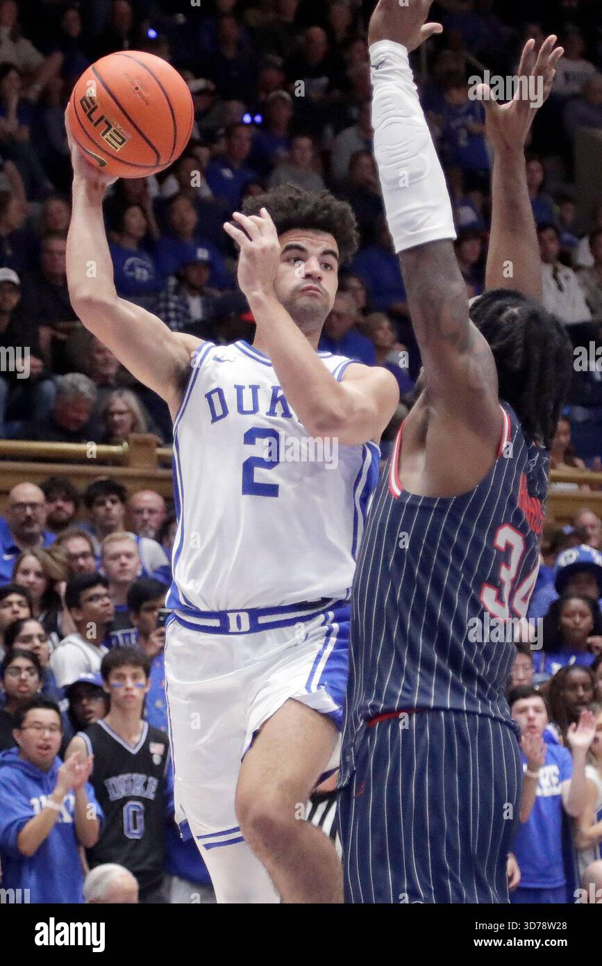 Duke guard Cayden Boozer (2) attempts to pass over Howard guard Bryce ...