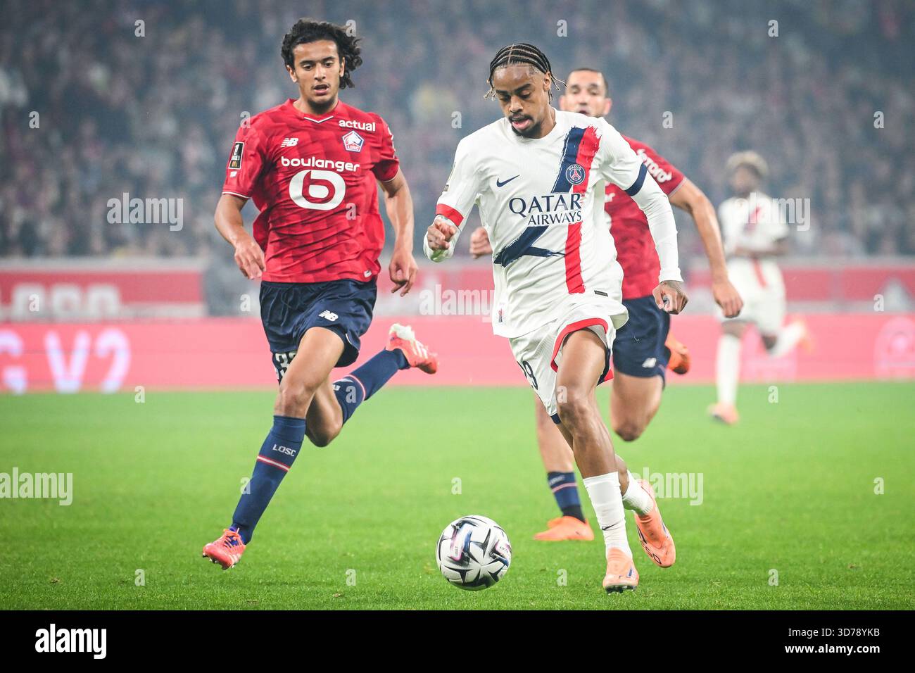 Ayyoub BOUADDI of Lille and Bradley BARCOLA of PSG during the French championship Ligue 1 ...