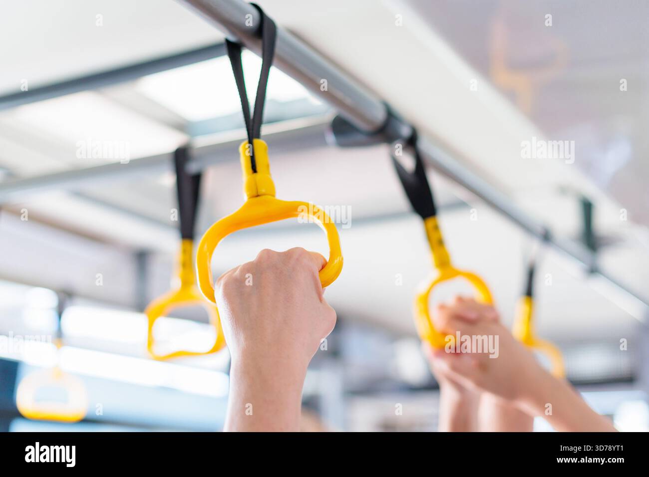 Passengers holding yellow hand hi-res stock photography and images - Alamy