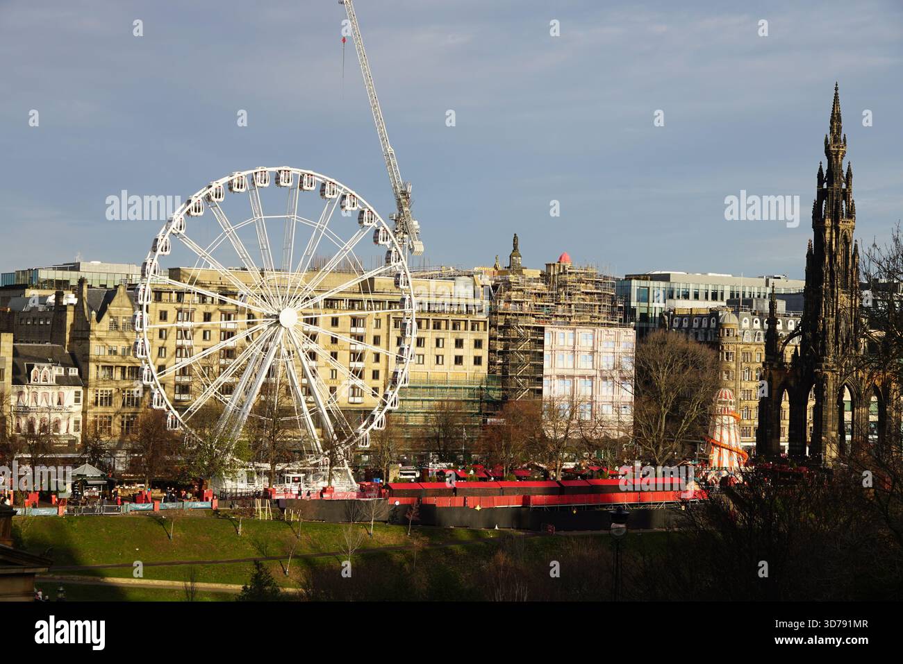 Ferris wheel and festive attractions in Edinburgh’s city centre, with ...