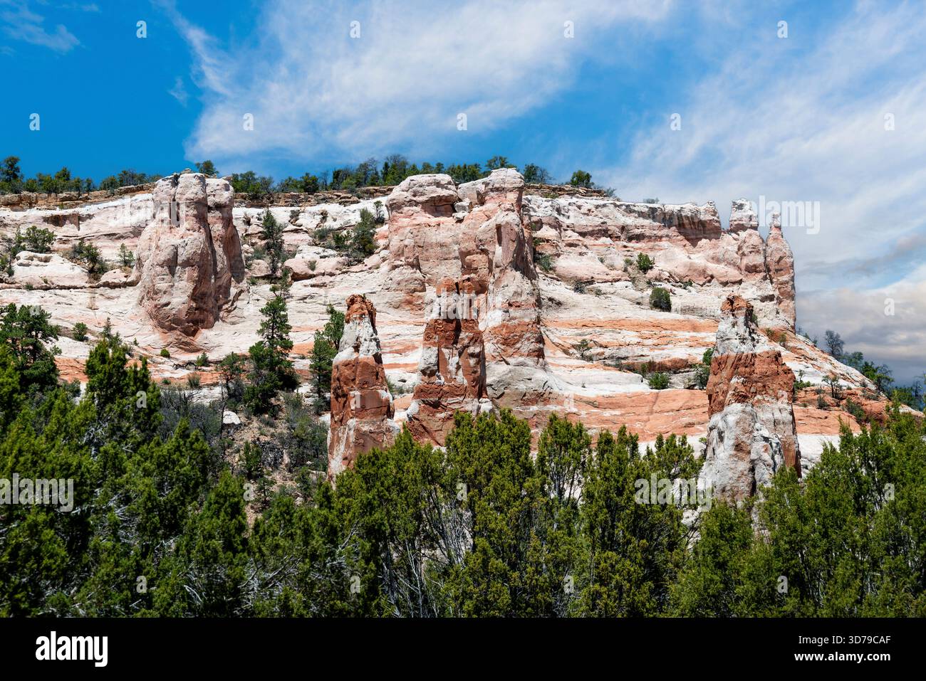 Along a quiet road near El Morro, New Mexico, the sandstone cliffs of ...