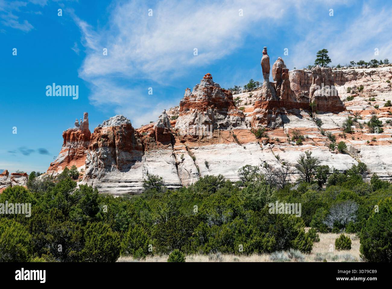 Along a quiet road near El Morro, New Mexico, the sandstone cliffs of ...