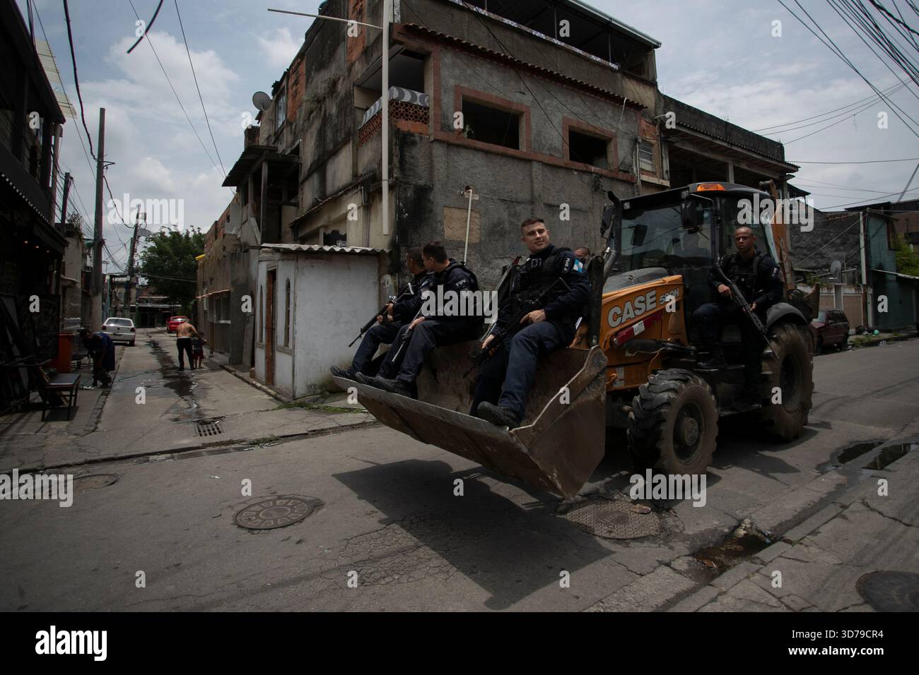 Police officers drive a bulldozer during a government-led operation to ...