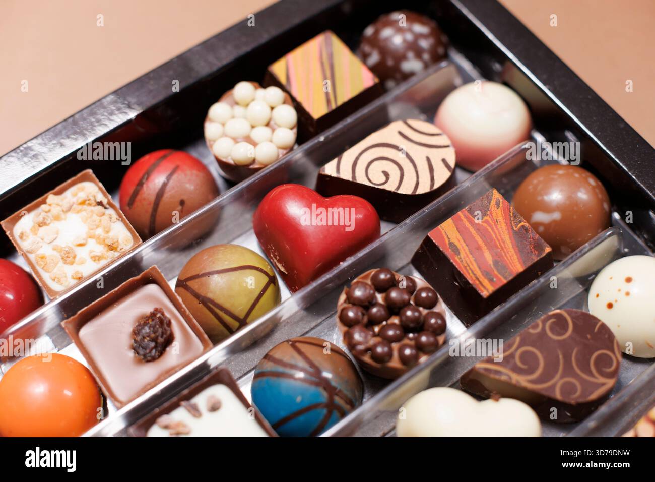 small chocolates with various shapes and colors Stock Photo - Alamy