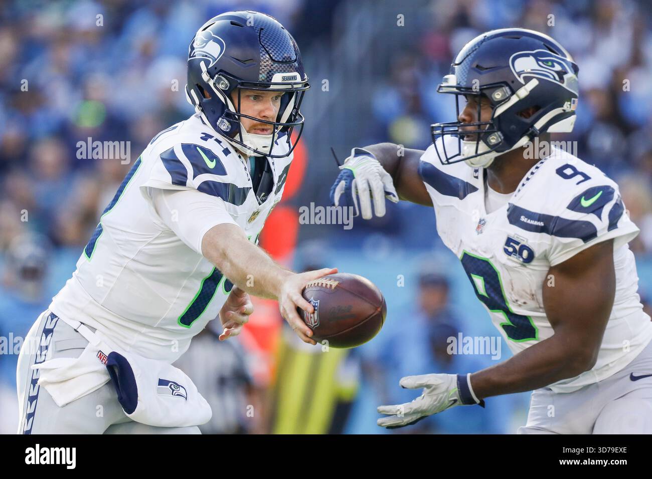 Seattle Seahawks quarterback Sam Darnold (14) hands the ball off to ...