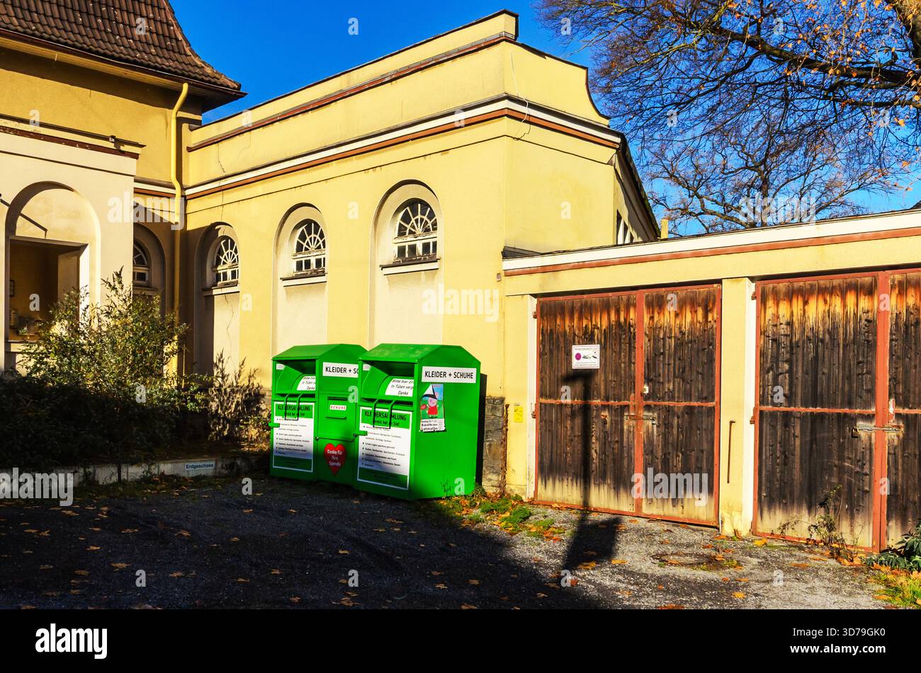 ISERLOHN, GERMANY — NOVEMBER 24 2025: green bins for clothing and shoe ...